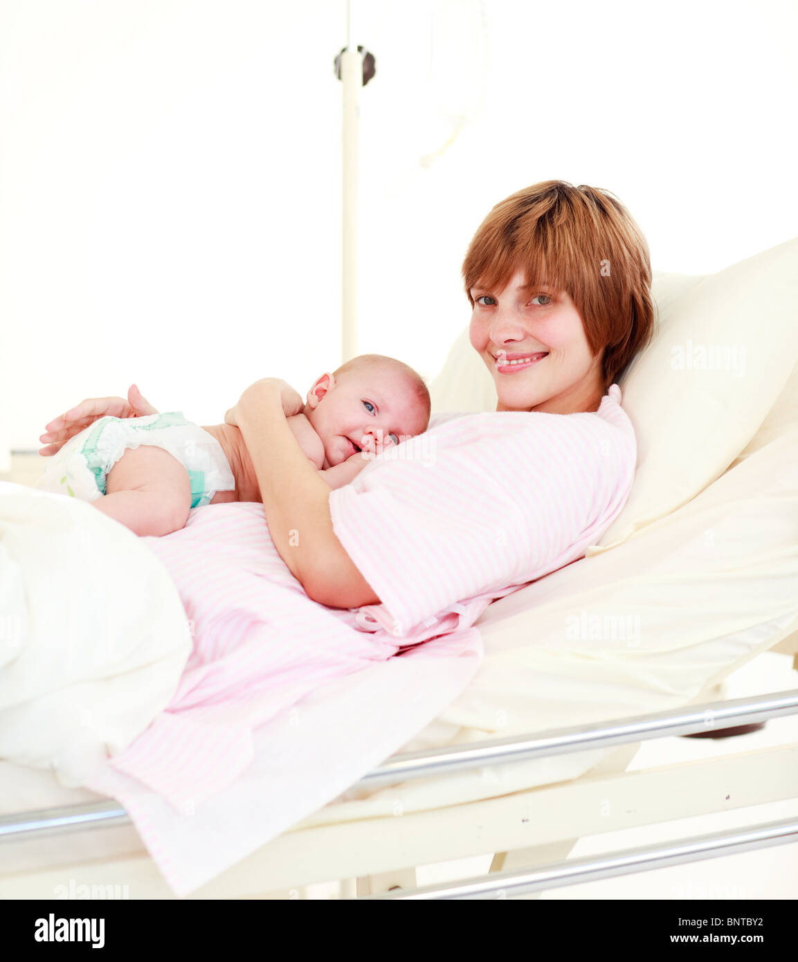 Mother holding her newborn baby Stock Photo - Alamy