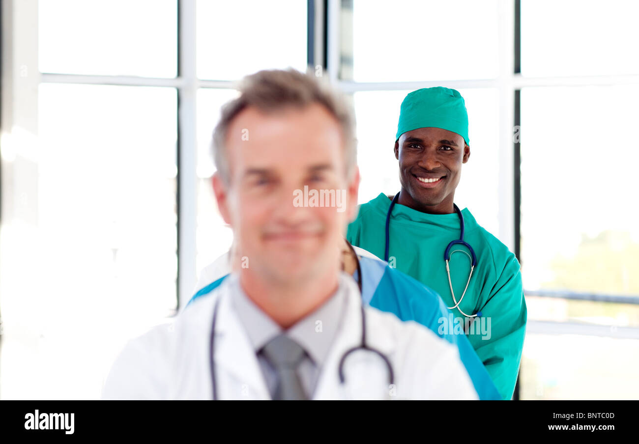 Smiling surgeon in a row Stock Photo - Alamy