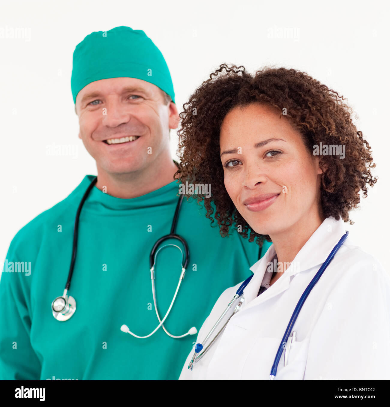 Team of smiling doctors looking at the camera Stock Photo - Alamy
