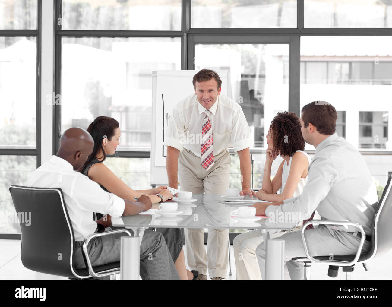 Senior Business man giving a presentation Stock Photo - Alamy