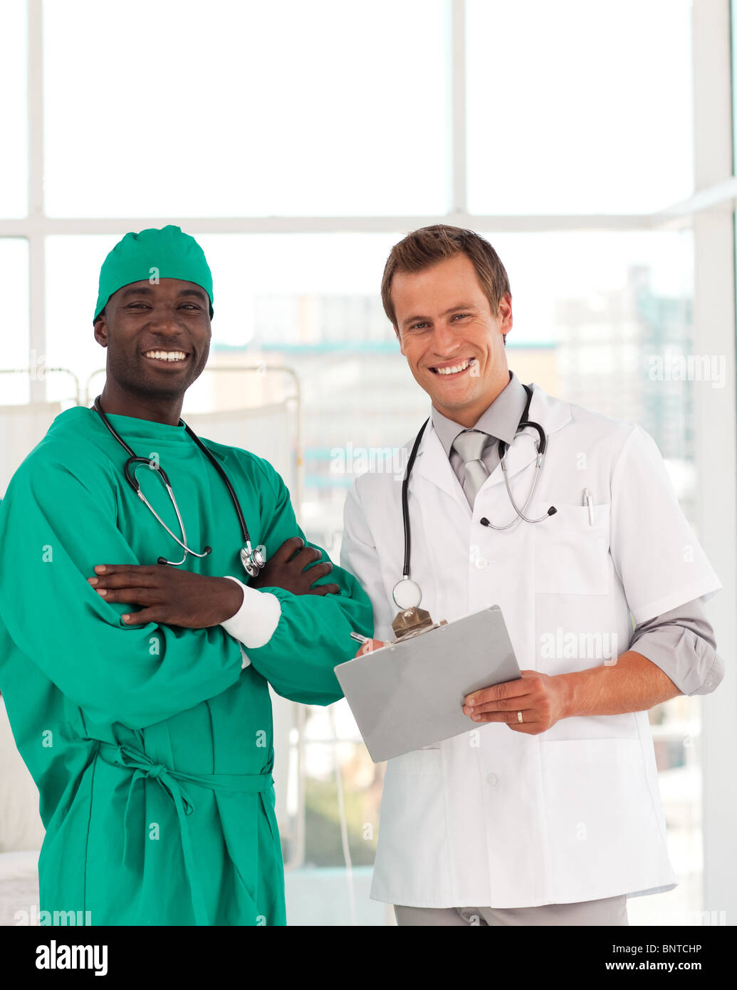 Two doctors looking at the camera Stock Photo - Alamy