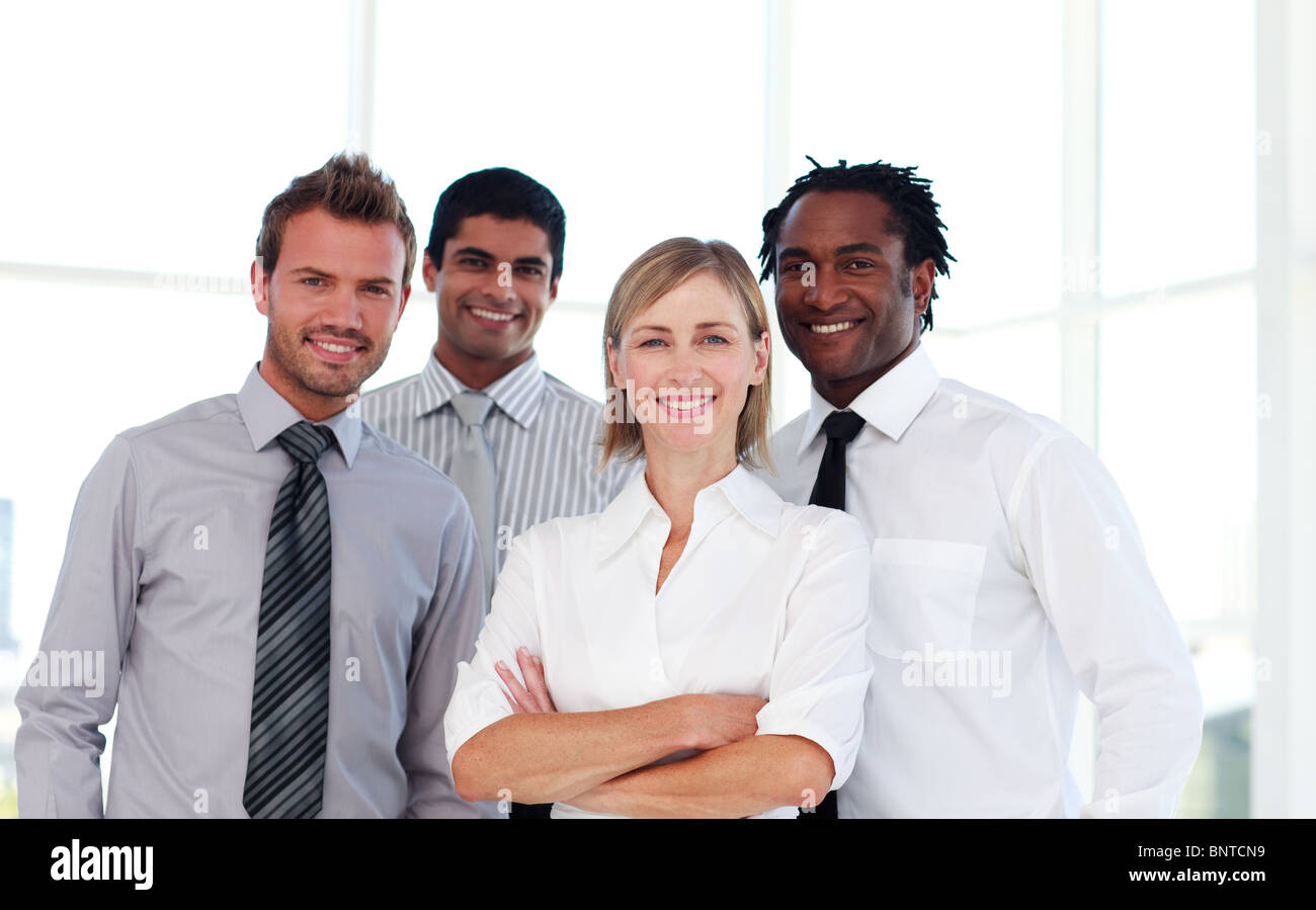 Confident business team smiling at the camera Stock Photo - Alamy