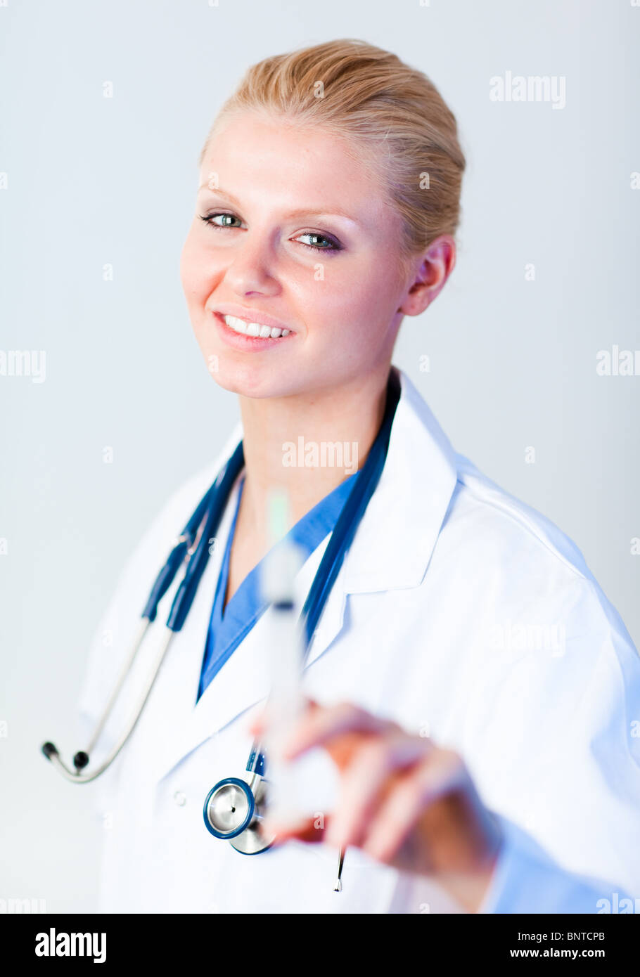 Doctor holding a needle Stock Photo - Alamy