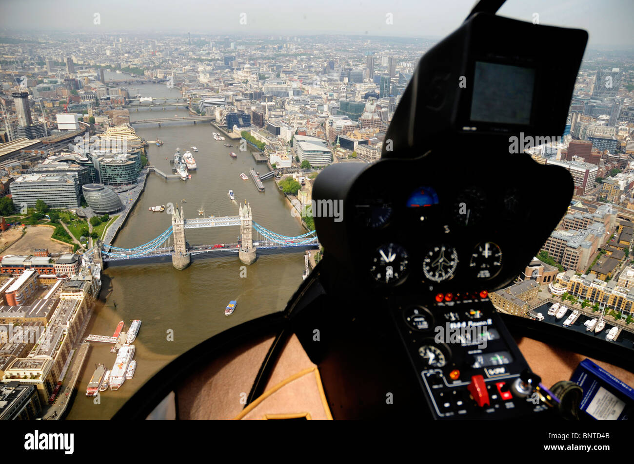 Aerial shot London Bridge from a Robinson R44 helicopter cockpit Stock ...