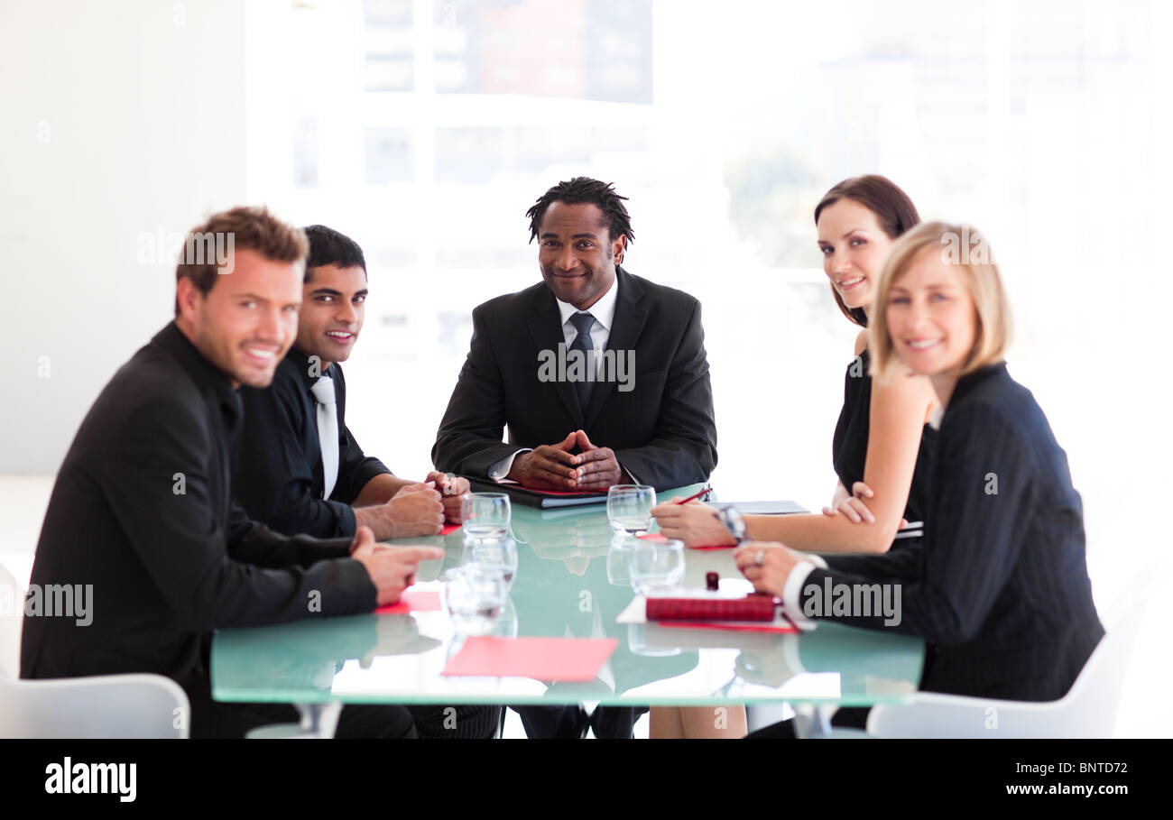 Happy colleagues congratulating leader hi-res stock photography and ...