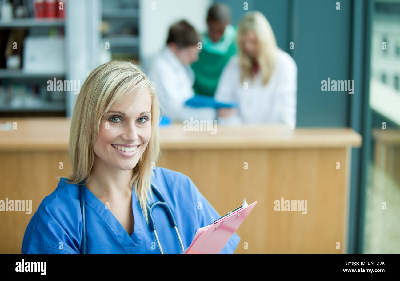 Caucasian female doctor looking at the camera Stock Photo - Alamy
