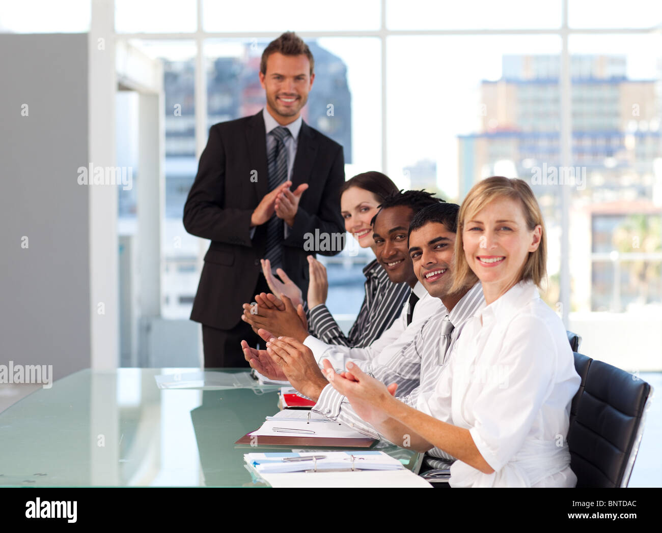 Business team clapping at the end of a presentation Stock Photo - Alamy