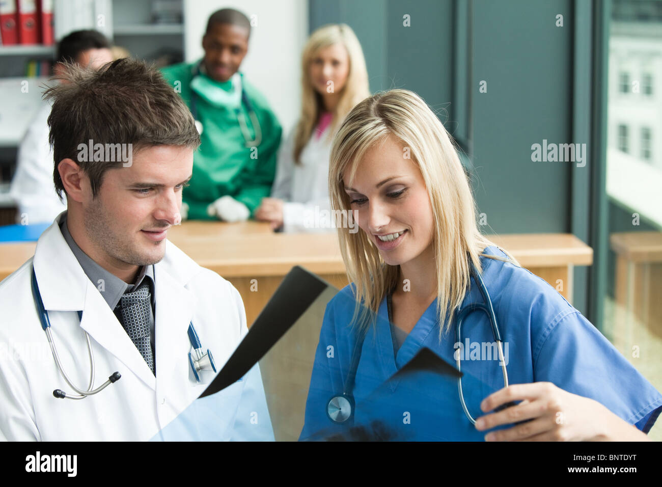 Doctors reading a document in hospital Stock Photo - Alamy