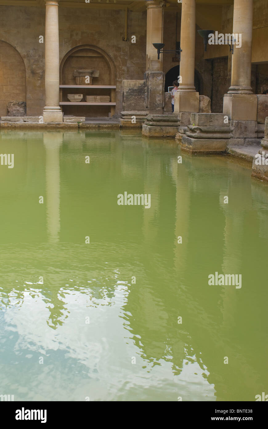 View across the Roman Baths showing reflections in the hot mineral ...