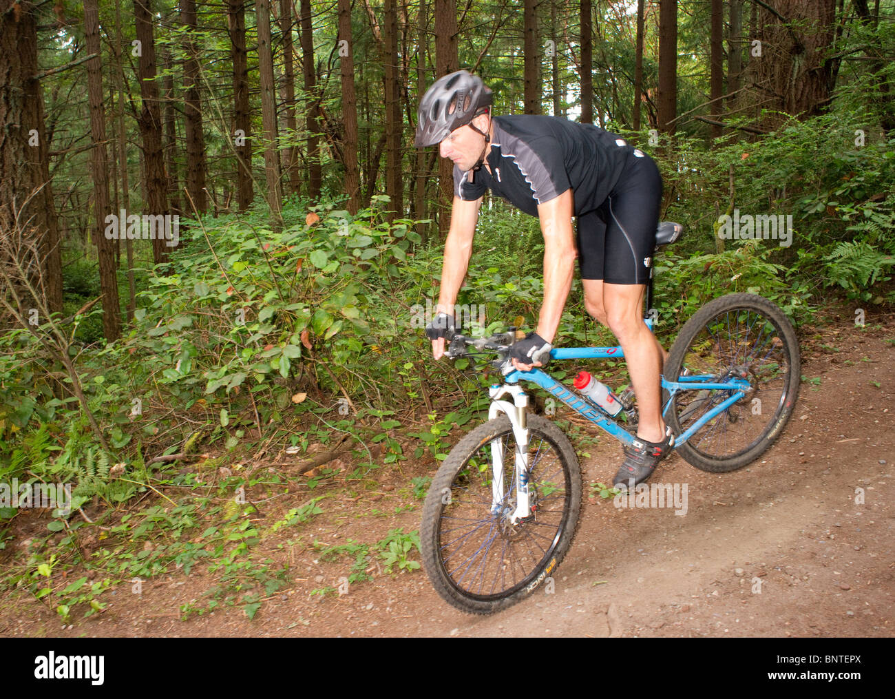 Male bike rider with his bicycle outside Stock Photo - Alamy