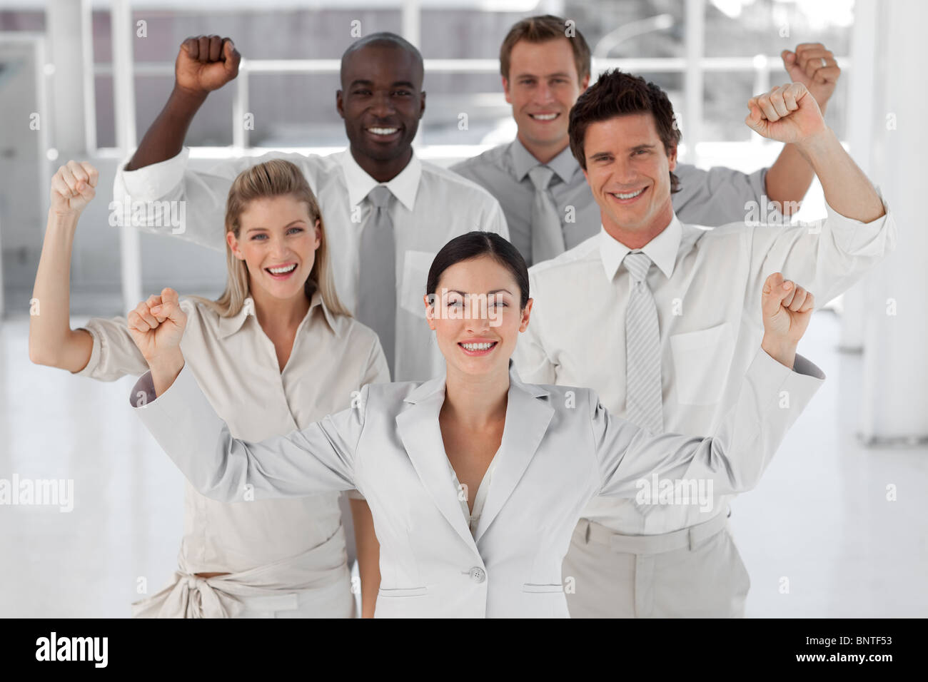 Business Team Smiling and Holding up Thumbs to camera Stock Photo - Alamy