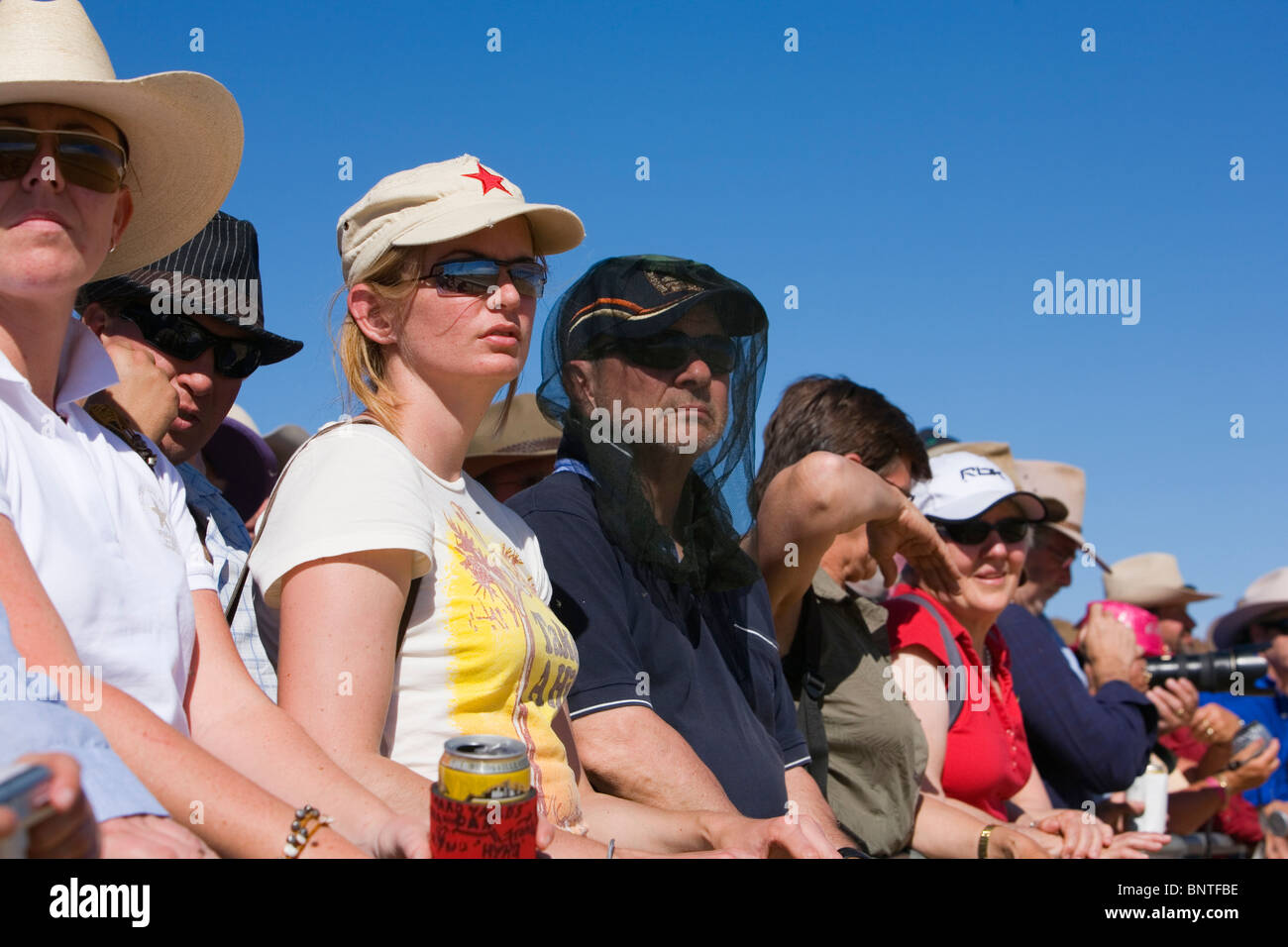 Spectators watch the horse racing action during the Birdsville races ...