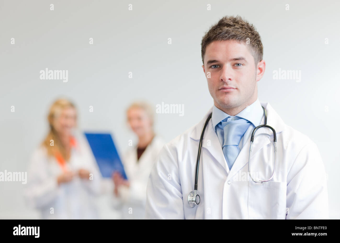 Handsome scientist looking at the camera Stock Photo - Alamy