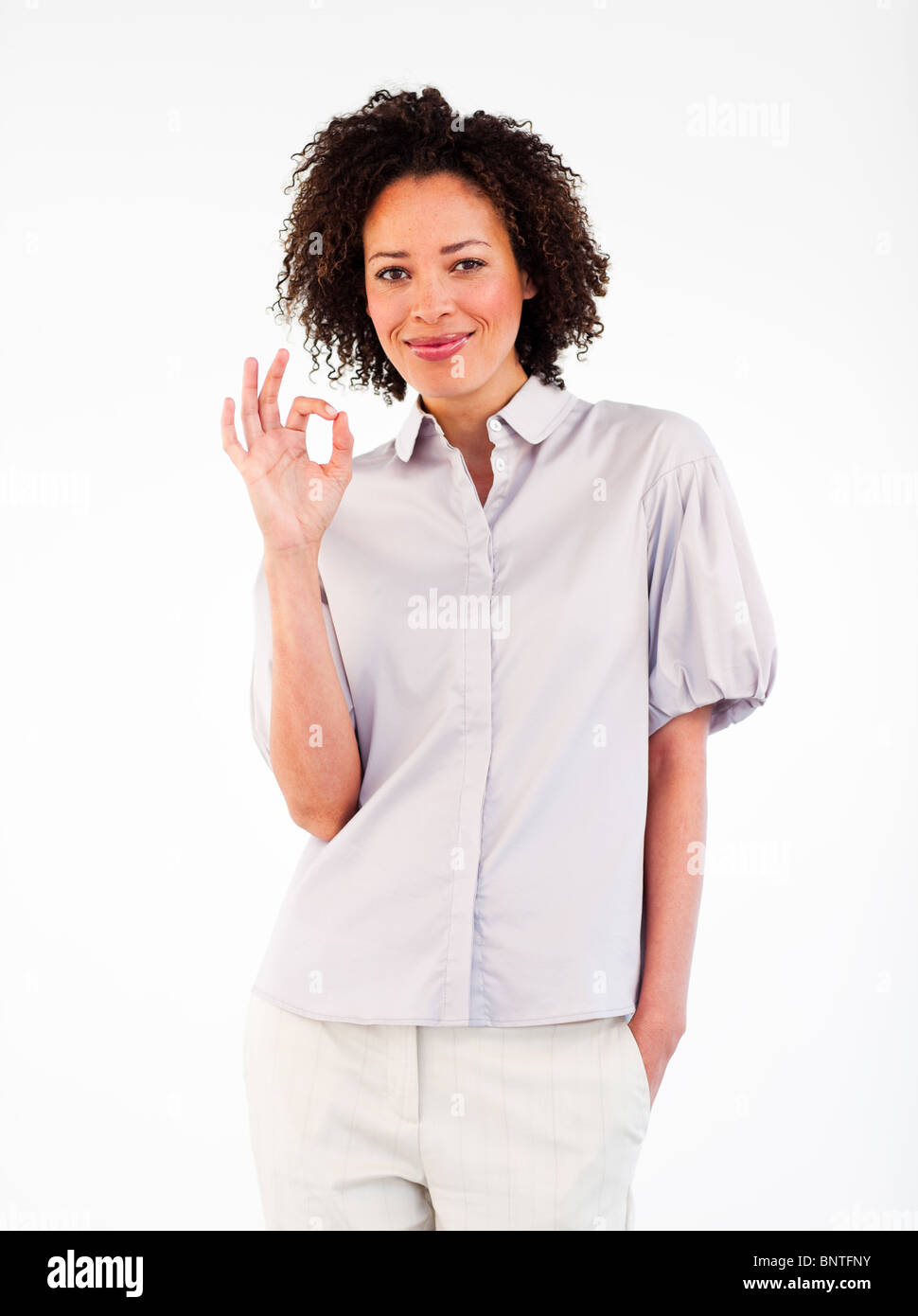 Young businesswoman showing okay sign Stock Photo - Alamy