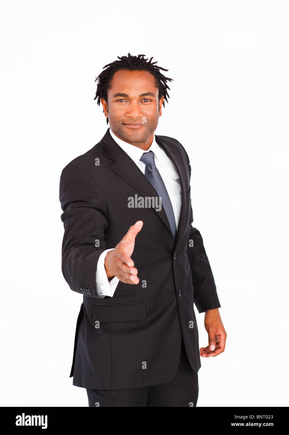 Friendly businessman greeting with handshake Stock Photo - Alamy
