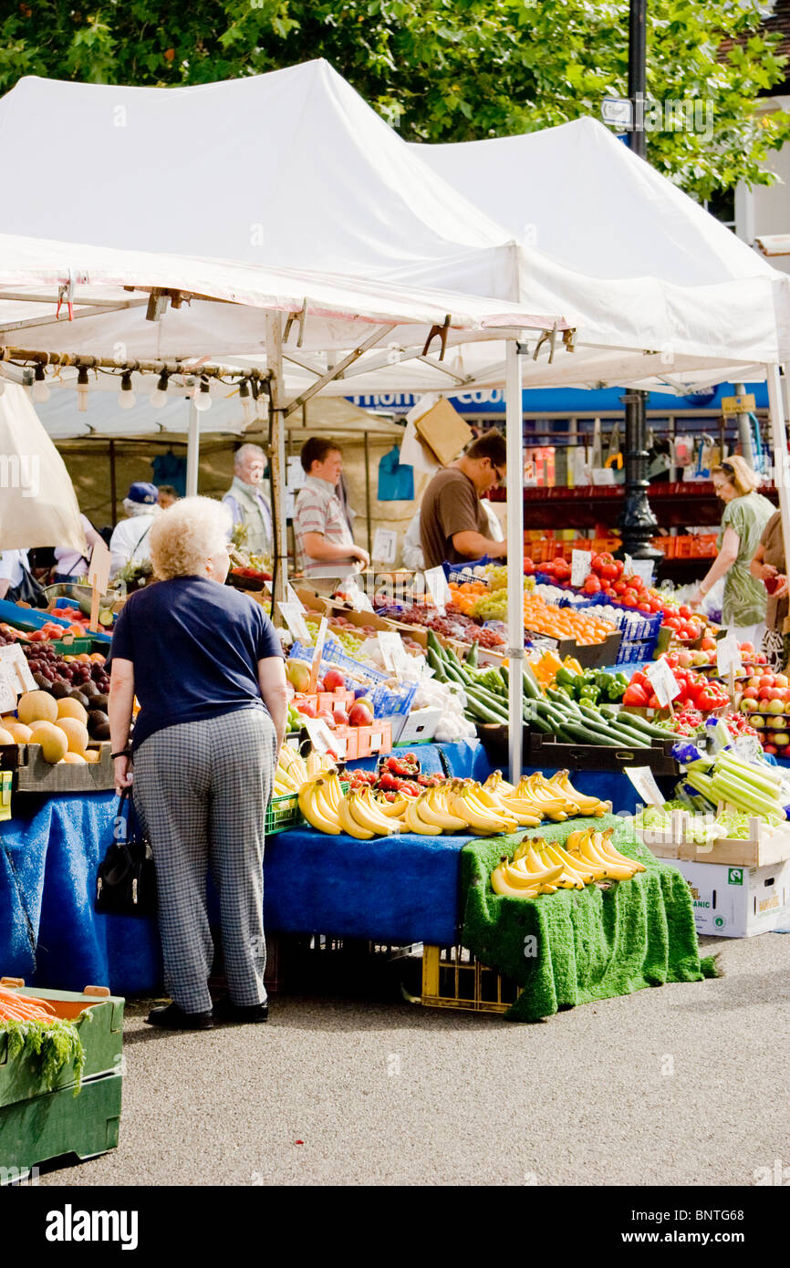 Mature woman at market stall, Bury St Edmunds, Suffolk, England Stock ...