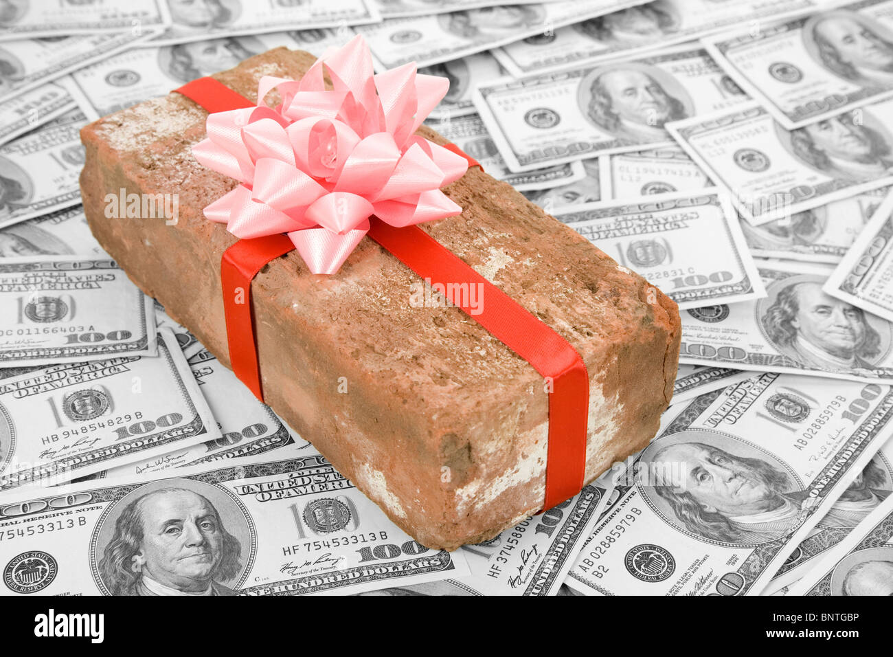 Red Brick Gift and dollars, Concept of joke, make fun of somebody, gift ...