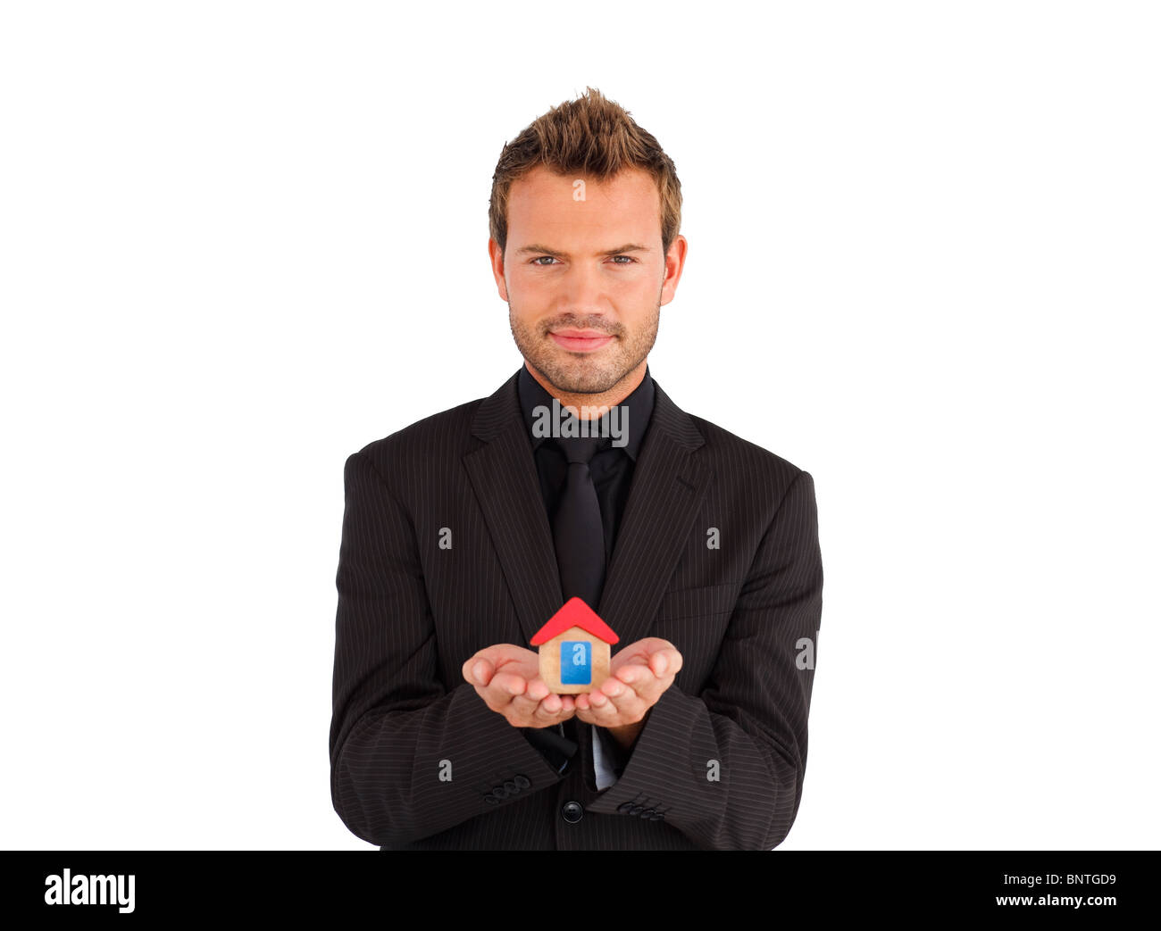 Businessman offering house Stock Photo - Alamy