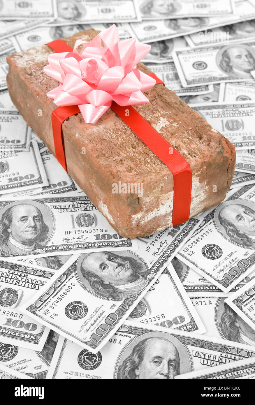 Red Brick Gift and dollars, Concept of joke, make fun of somebody, gift ...