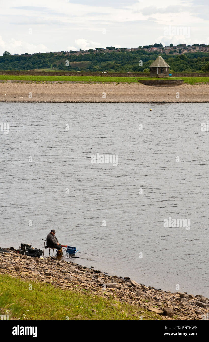 Angler fishing a deep reservoir Stock Photo - Alamy