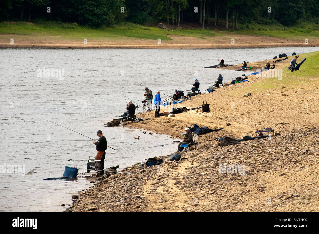 Anglers fishing on a reservoir Stock Photo - Alamy