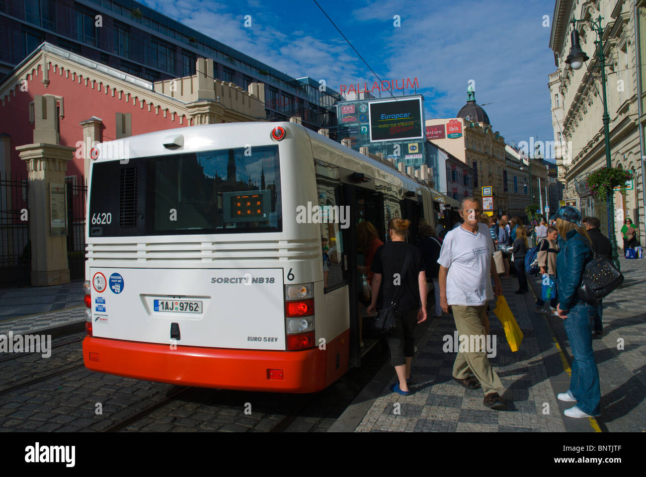 People getting on and off bus at namesti Republiky stop central Prague ...