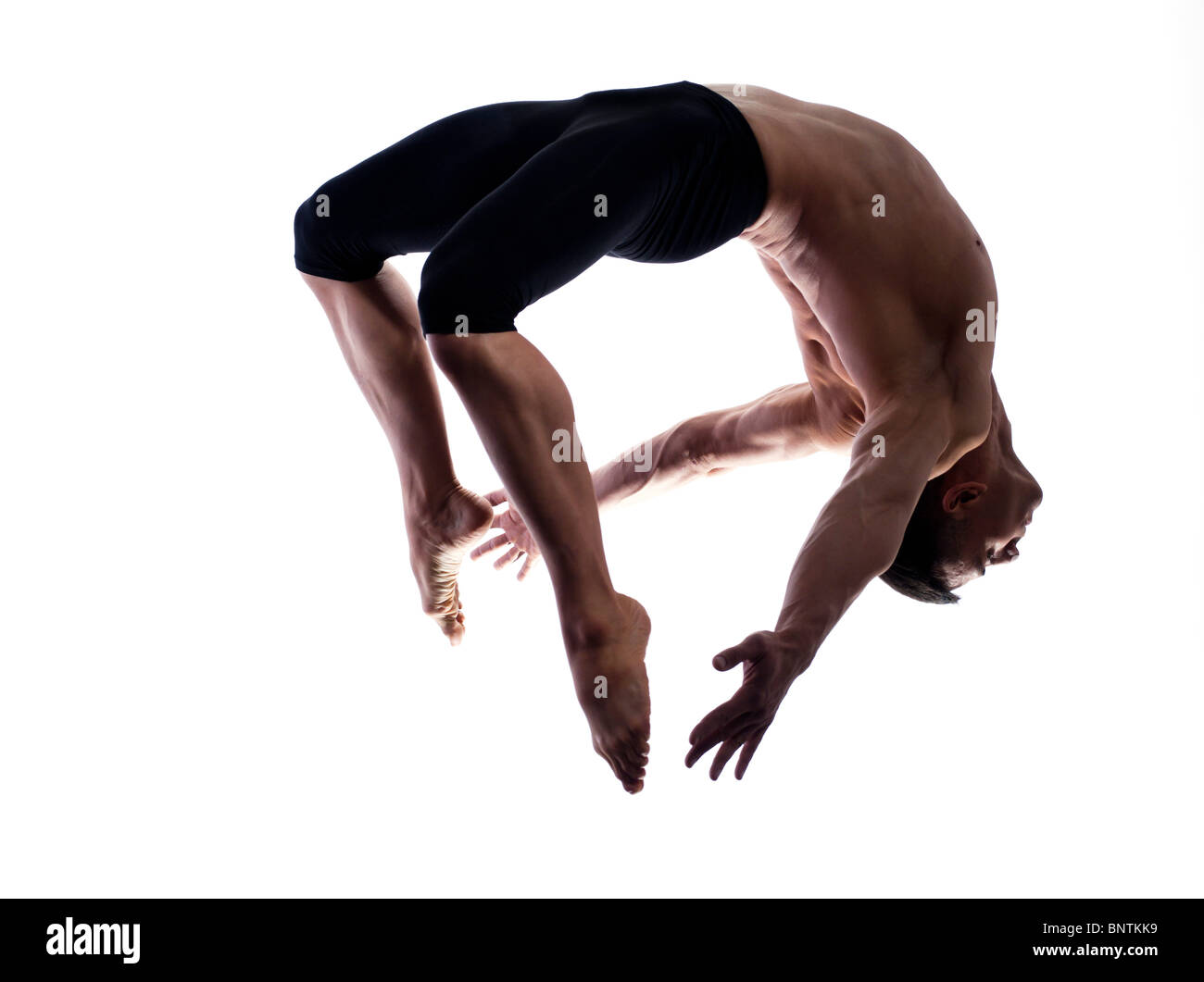one caucasian modern ballet dancer dancing gymnastic acrobatic jumping ...