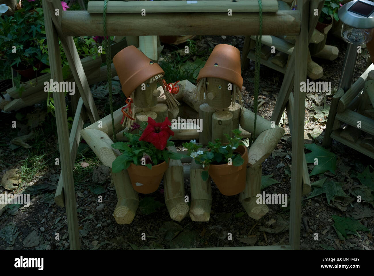 Flower pot men on a garden swing, Bath Flower Show, Bath Somerset UK ...
