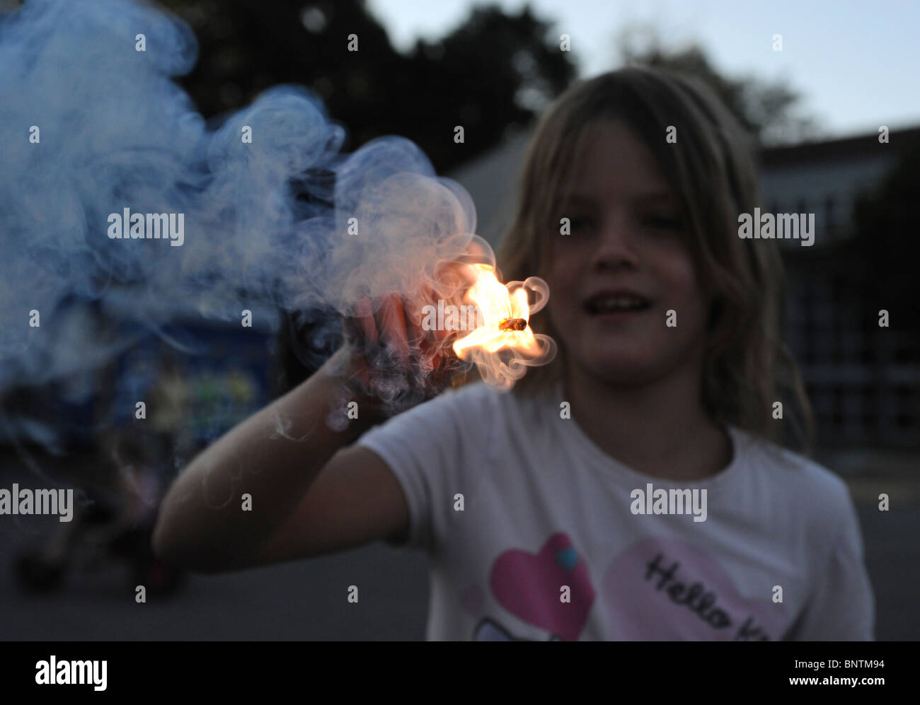girls with matchstick on a party outside Stock Photo - Alamy