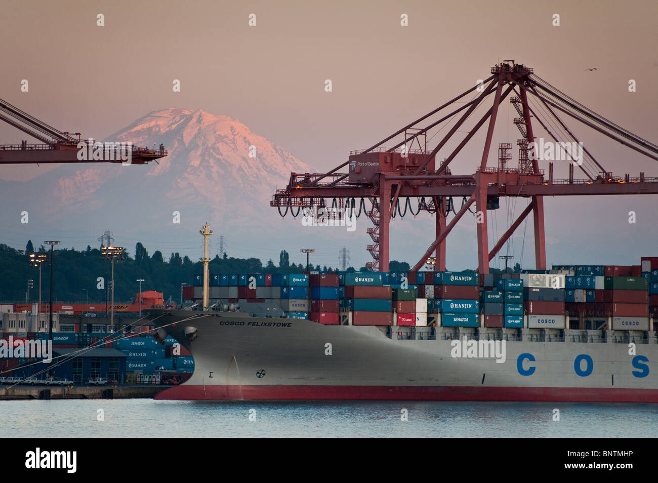 Huge cranes load and unload cargo at the Port of Seattle, Washington ...
