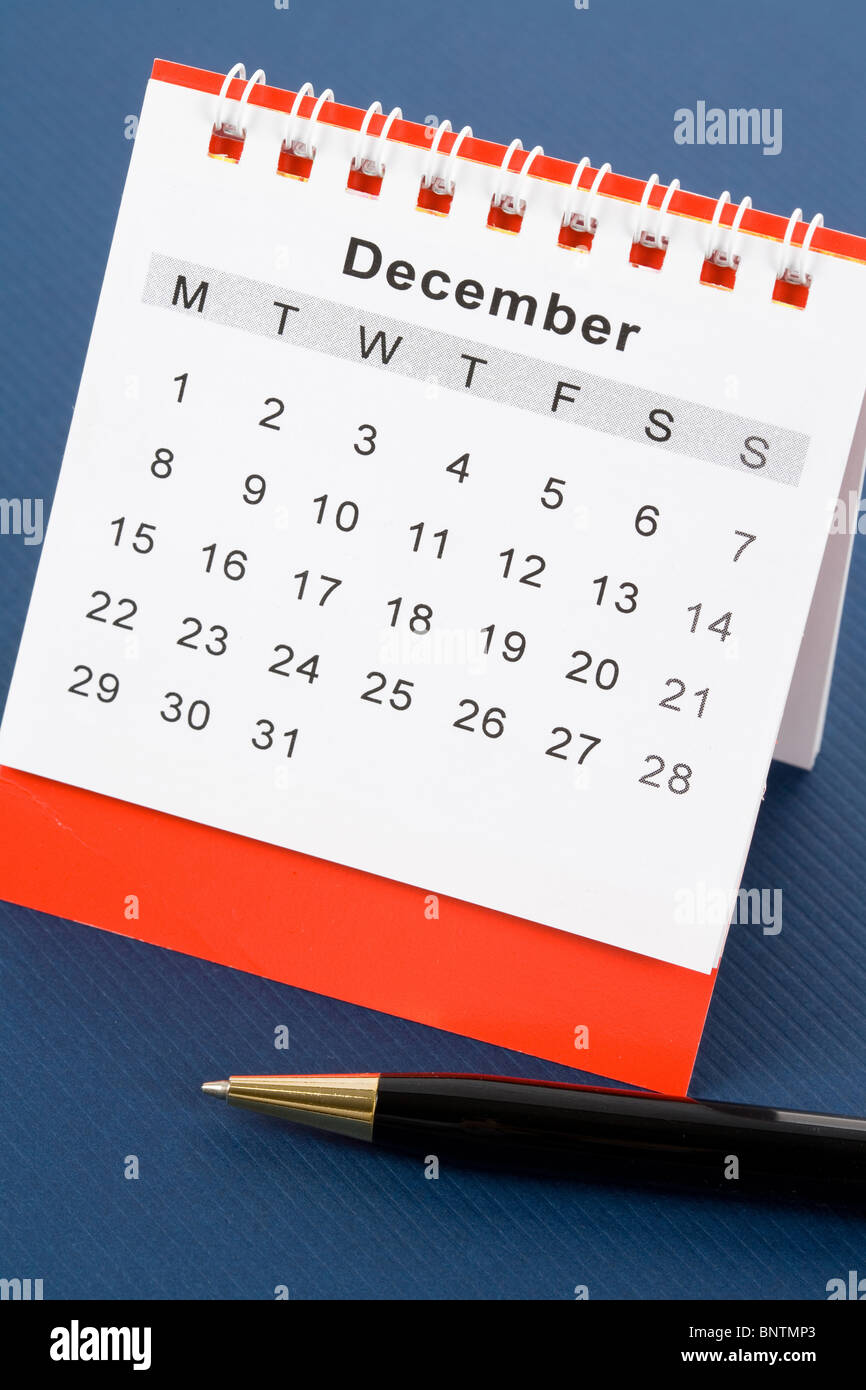 Calendar December close up with blue background Stock Photo - Alamy