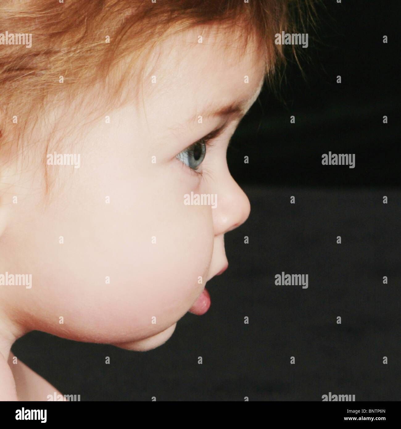 Baby face close-up redhead profile Stock Photo - Alamy