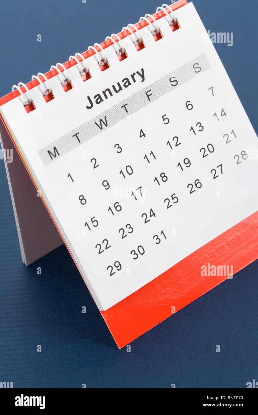 Calendar January close up with blue background Stock Photo - Alamy