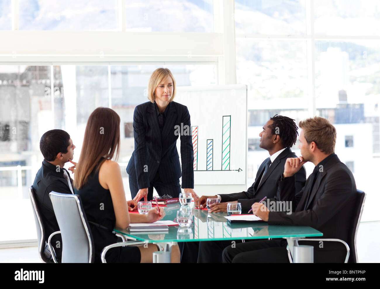 Businesswoman interacting to her team Stock Photo - Alamy Businesswoman interacting to her team Stock Photo - Alamy