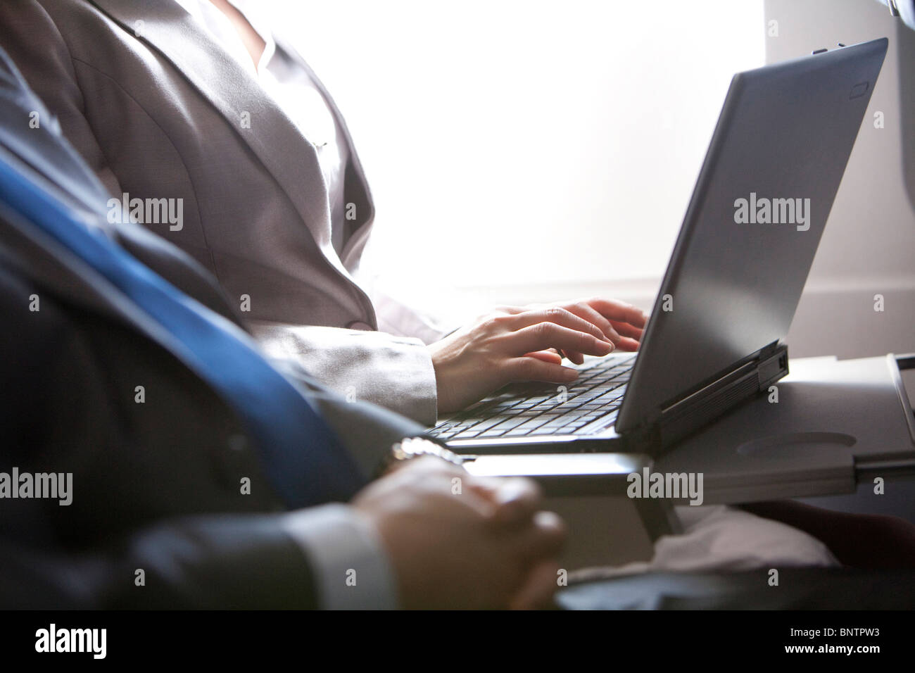 Businesspeople working on the plane Stock Photo - Alamy