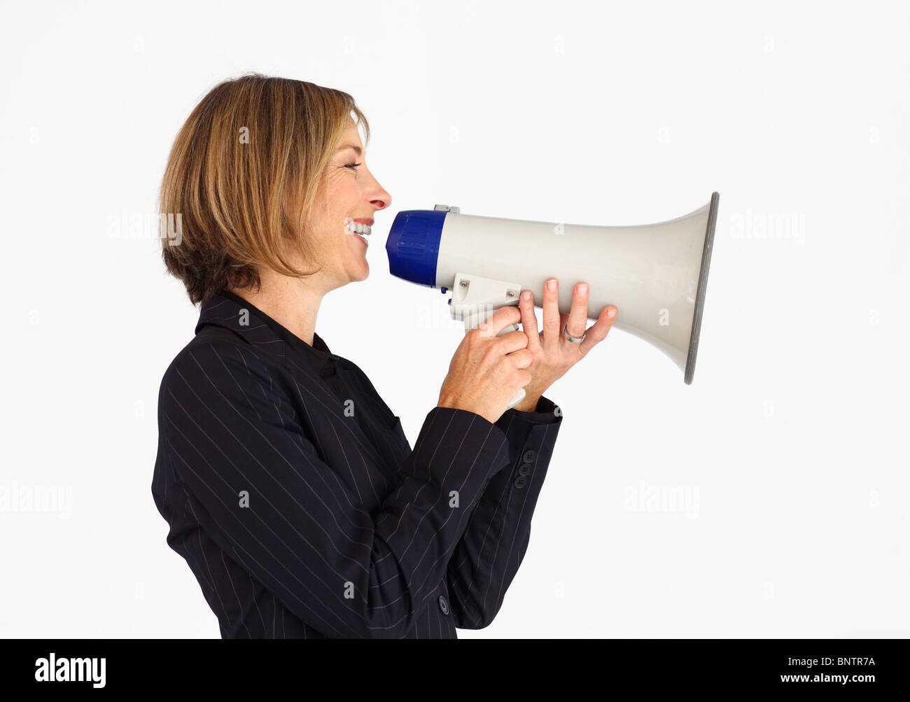 Profile of a businesswoman speaking through a megaphone Stock Photo - Alamy