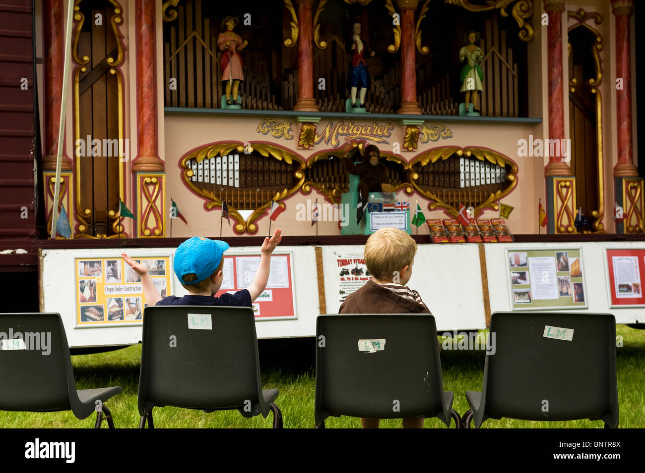 Two young boys listening to a steam organ. Photo by Gordon Scammell ...