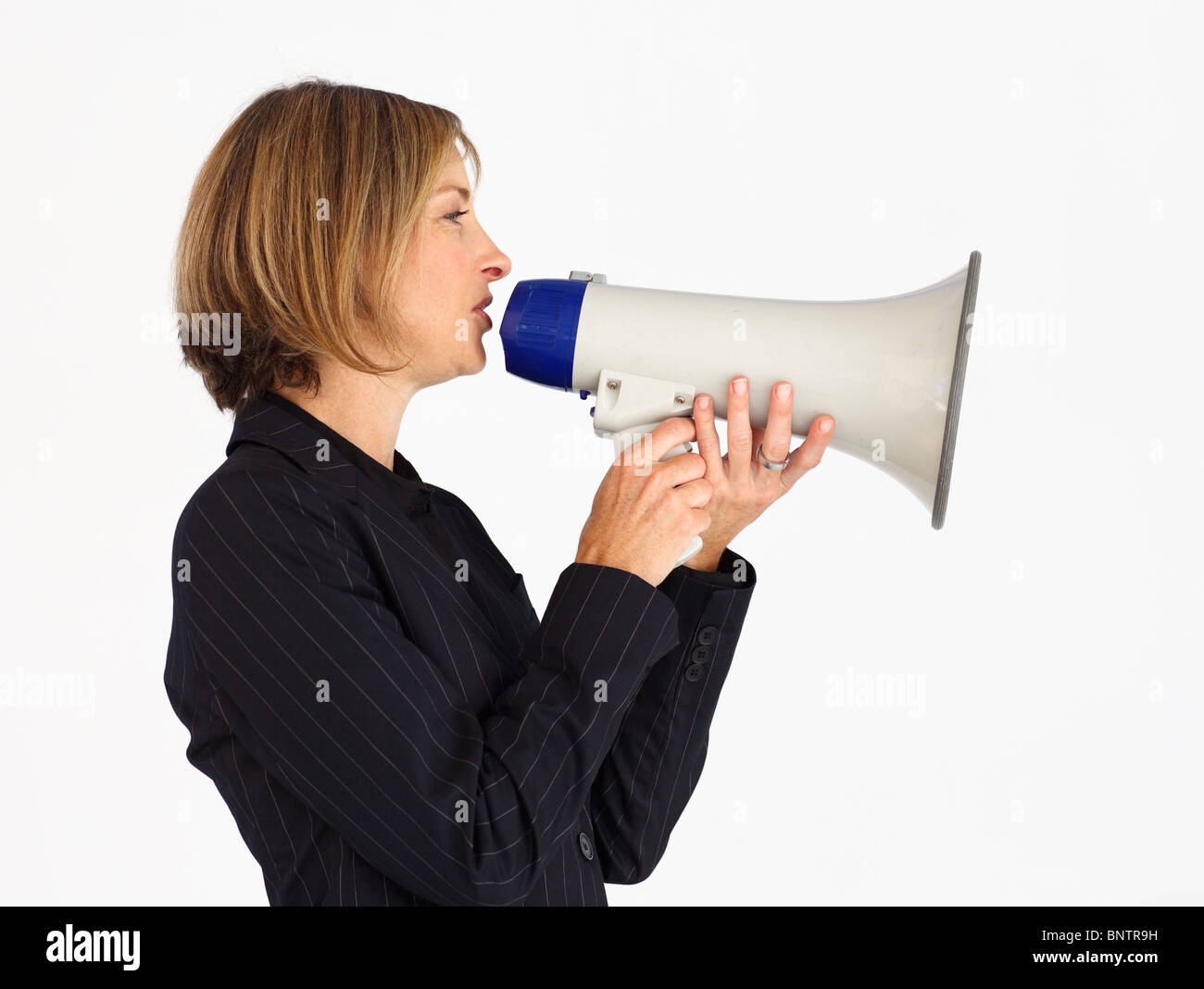 Profile of a businesswoman shouting through a megaphone Stock Photo - Alamy