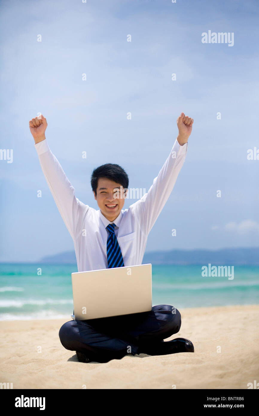 Businessman working at the beach Stock Photo - Alamy