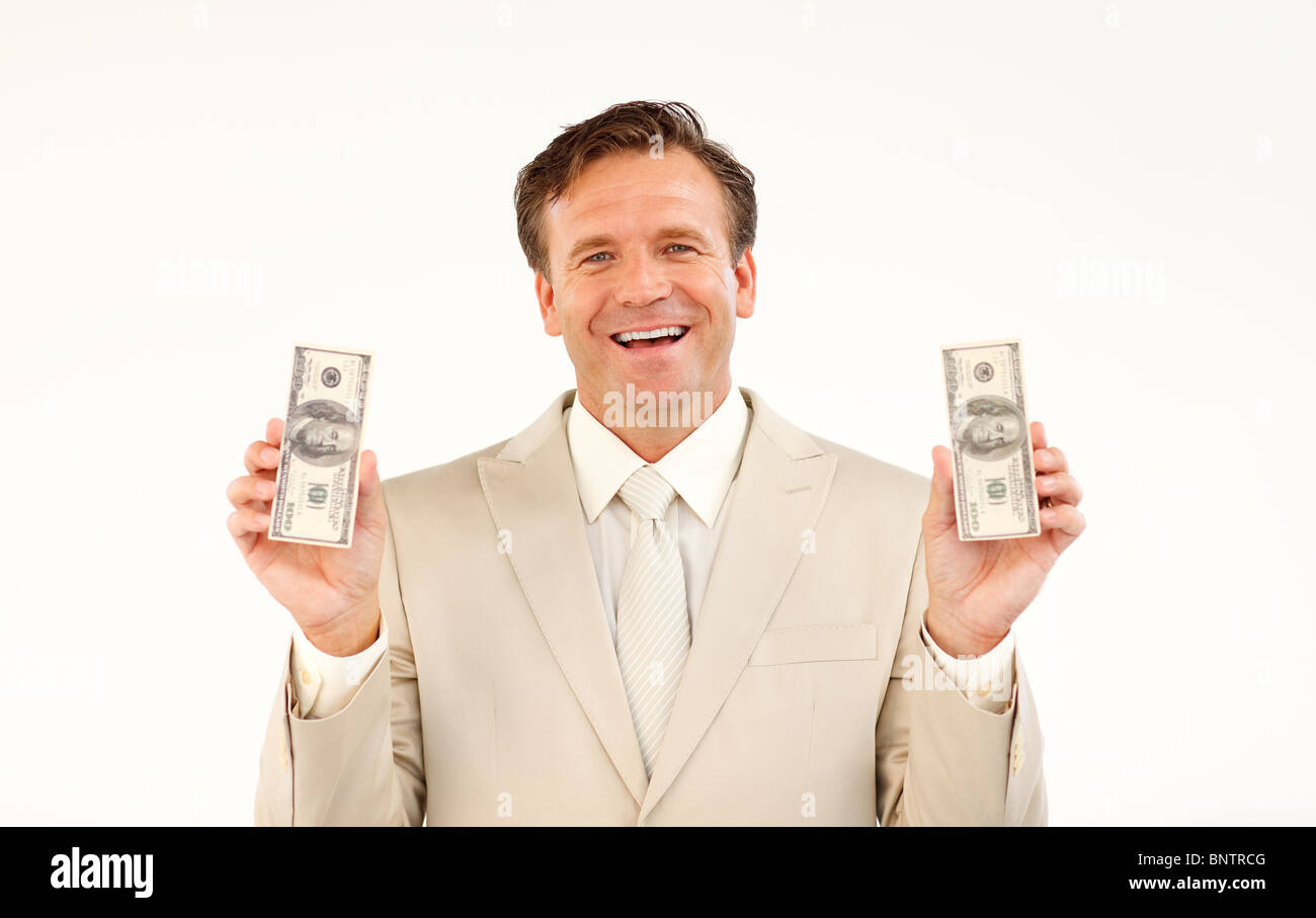 Friendly businessman holding dollars Stock Photo - Alamy