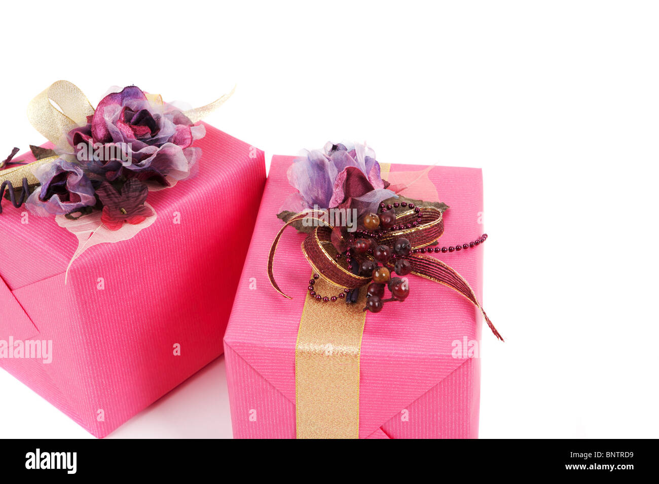 Two presents gift-wrapped in pink, studio shot Stock Photo - Alamy