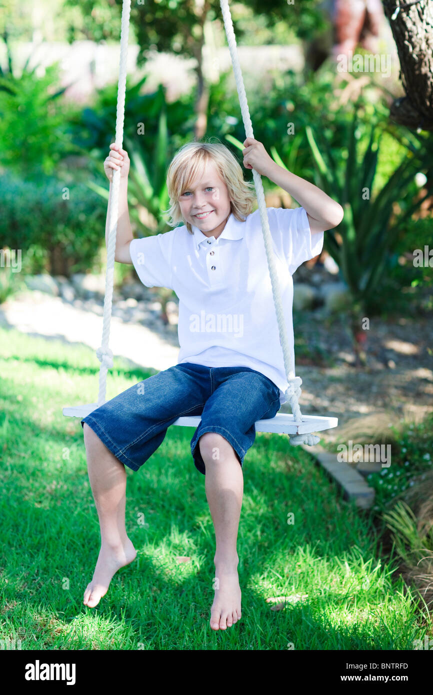 Child playing with a swing Stock Photo - Alamy