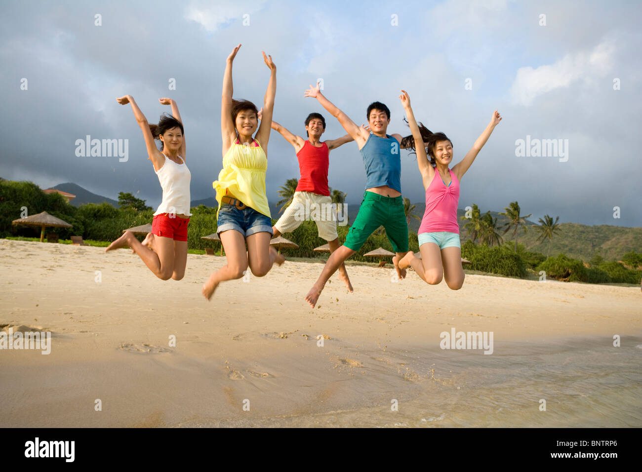 Friends having fun at the beach Stock Photo - Alamy