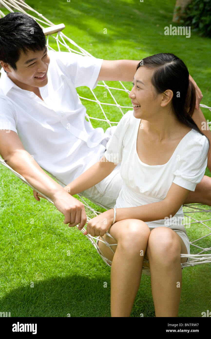 Portrait of a young couple in a hammock Stock Photo - Alamy