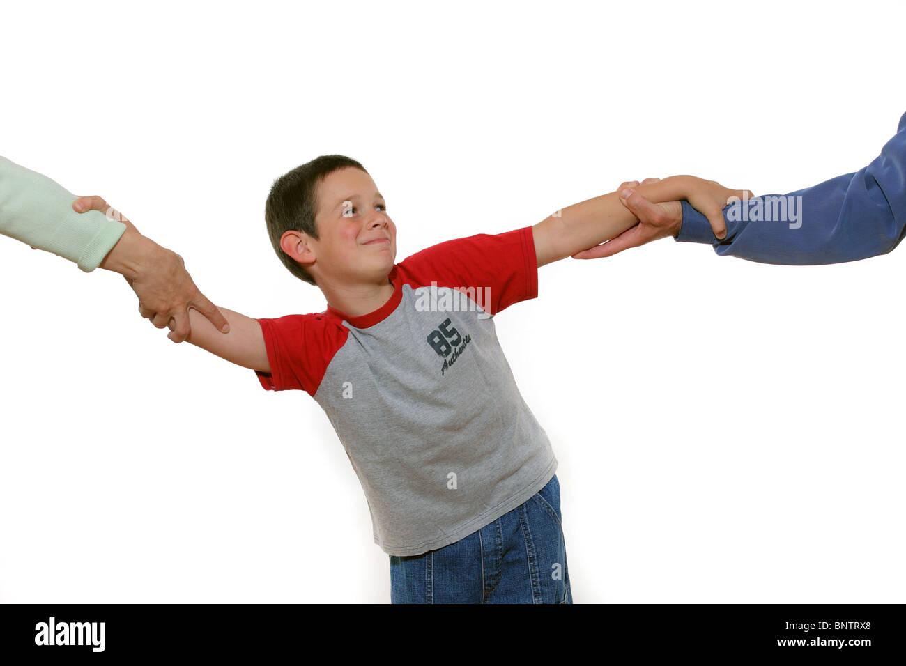 A posed image depicting the child torn between two parents in conflict ...