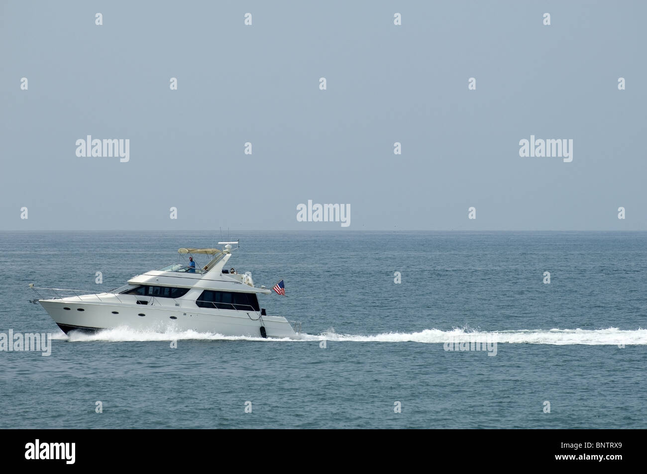 White boat on the ocean Stock Photo - Alamy