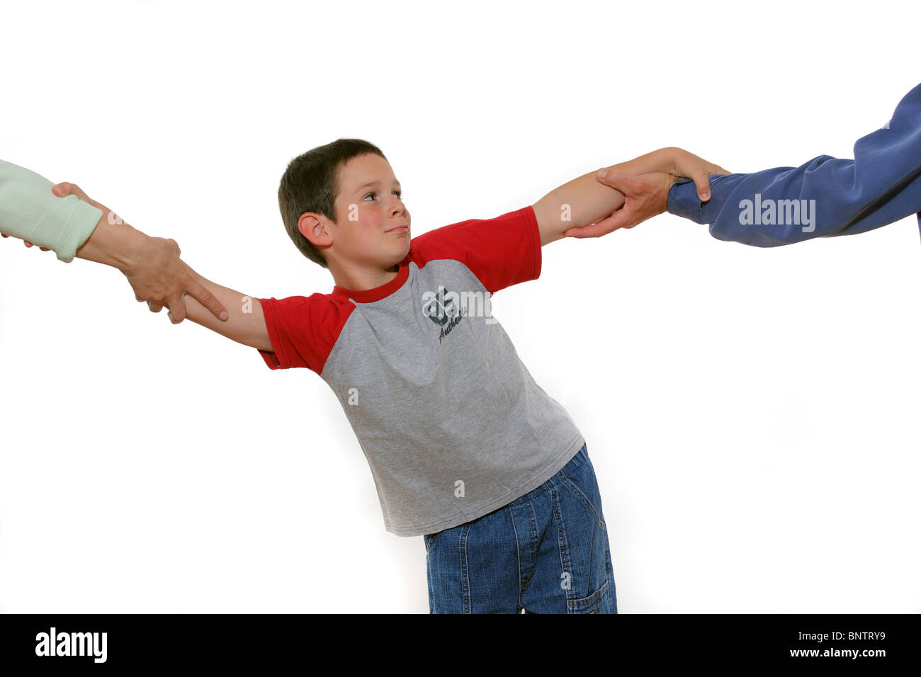 A posed image depicting the child torn between two parents in conflict ...
