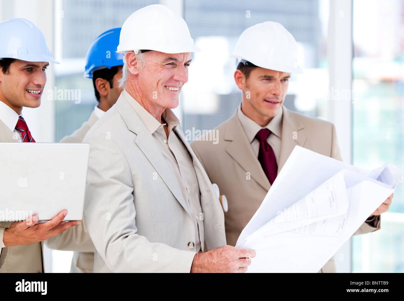 Architect team working on a building project Stock Photo - Alamy