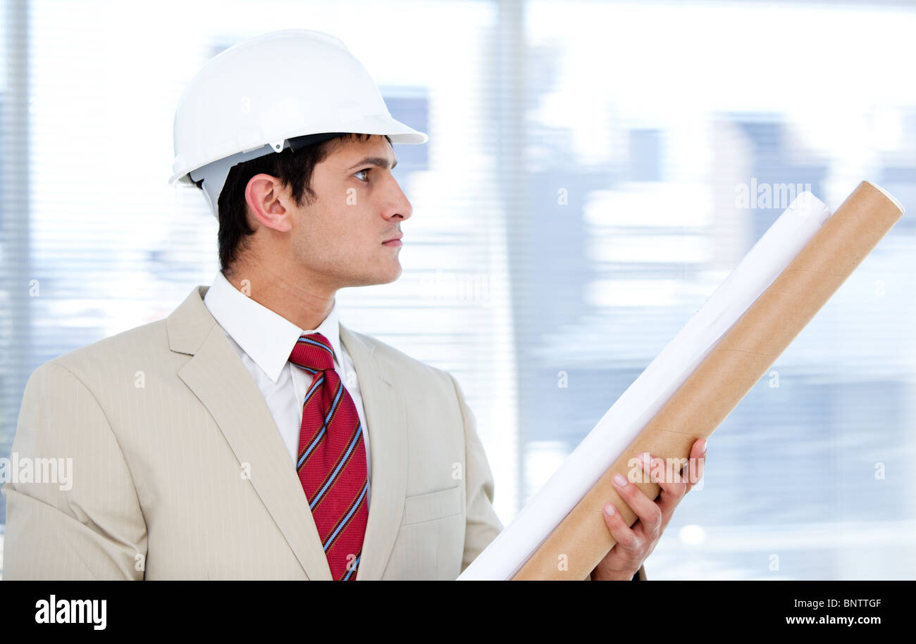 Caucasian architect holding a blueprint Stock Photo - Alamy