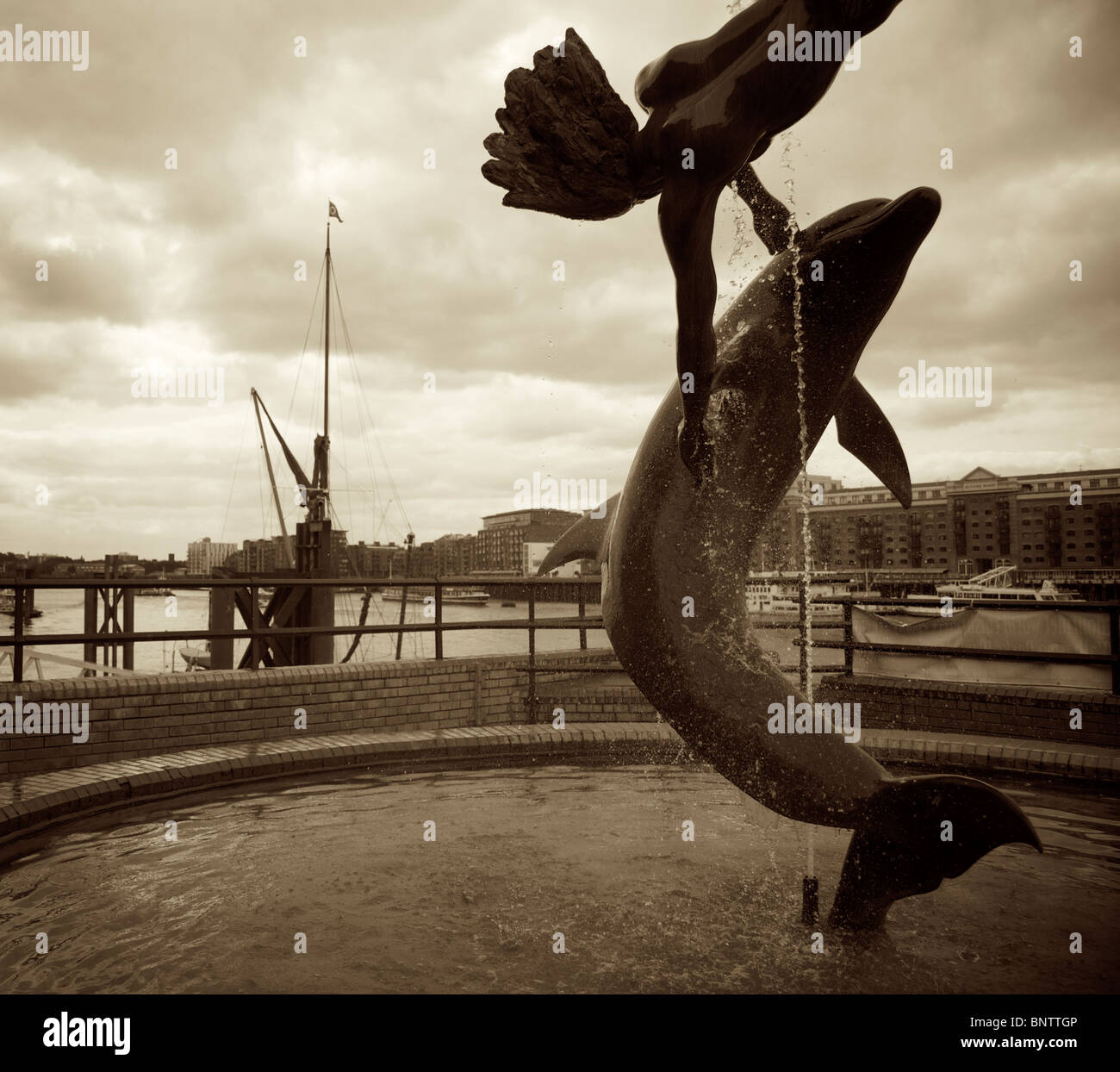 Dolphin and boy statue hi-res stock photography and images - Alamy